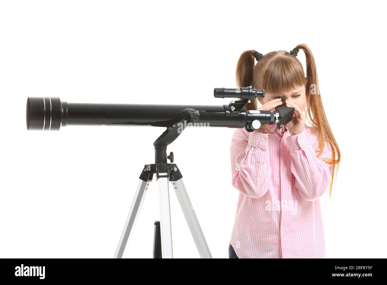 Cute little girl with telescope on white background Stock Photo - Alamy