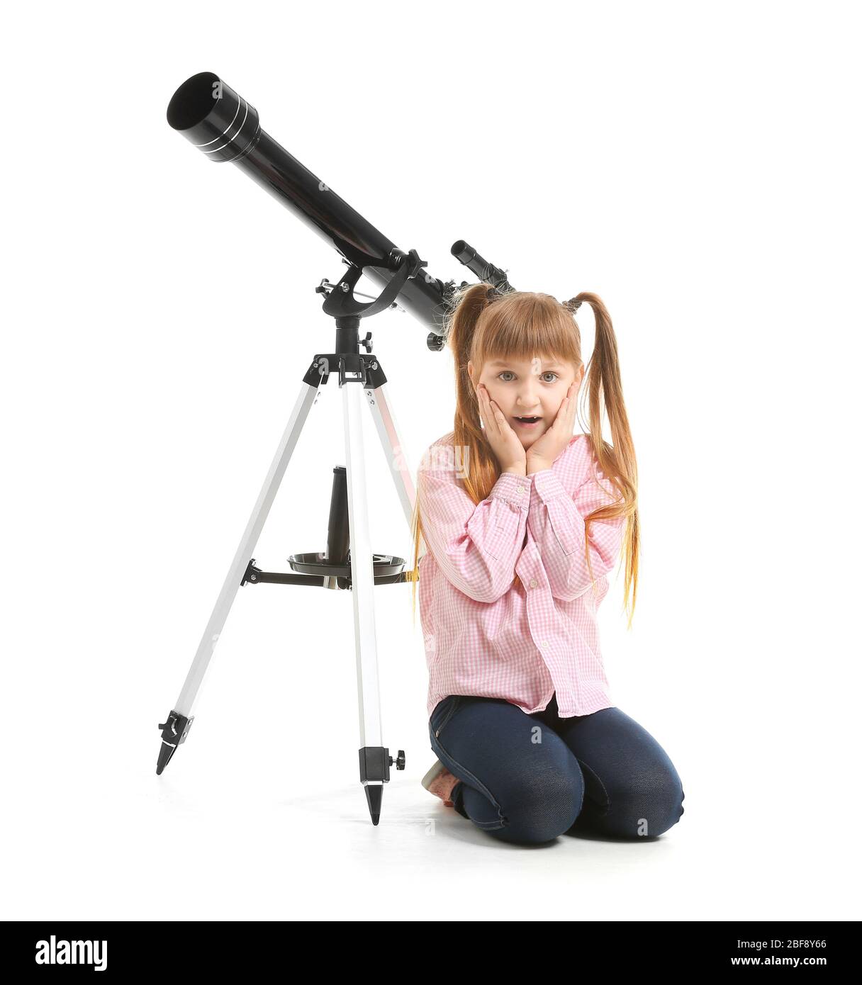 Cute surprised little girl with telescope on white background Stock ...