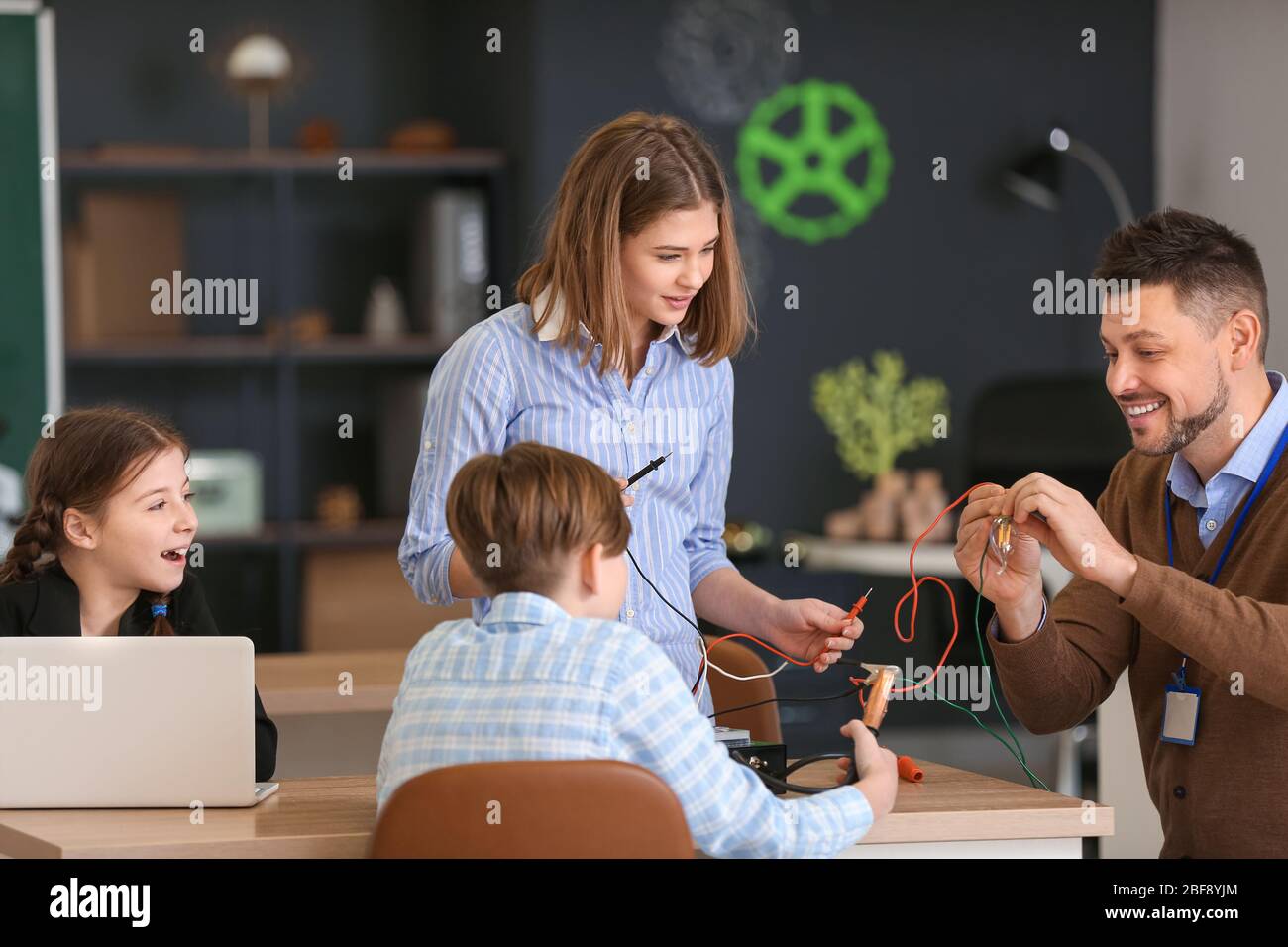 Teacher conducting physics lesson in classroom Stock Photo - Alamy