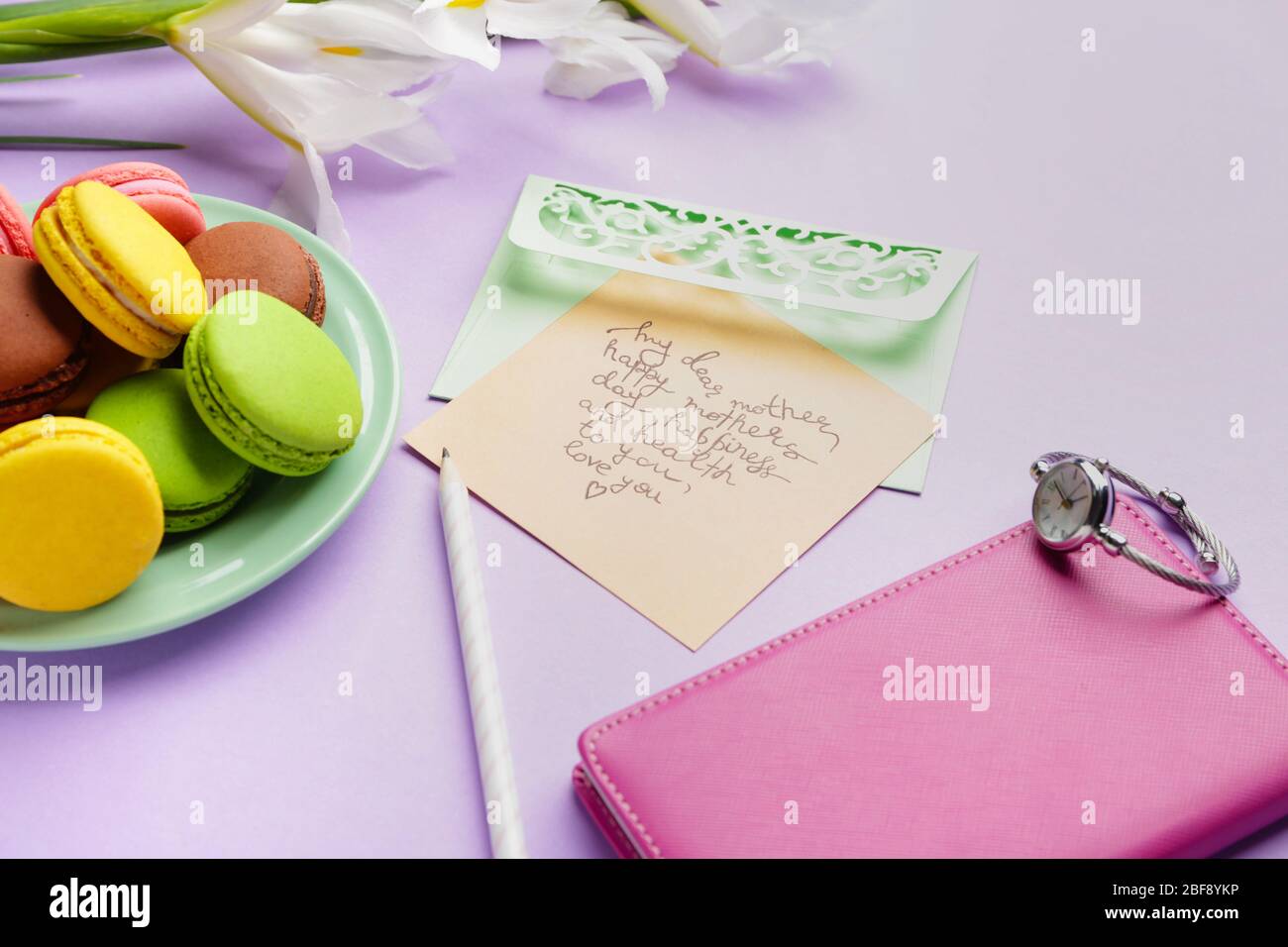 Composition with greeting card for mother on color background Stock ...