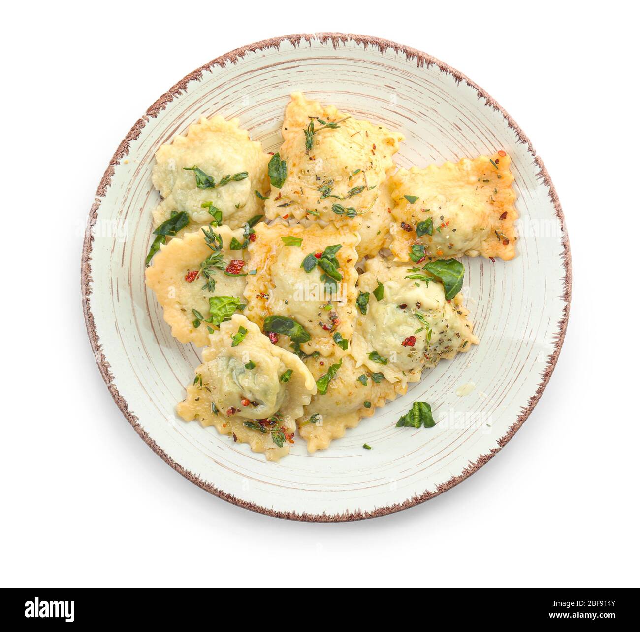 Plate with tasty ravioli on white background Stock Photo - Alamy