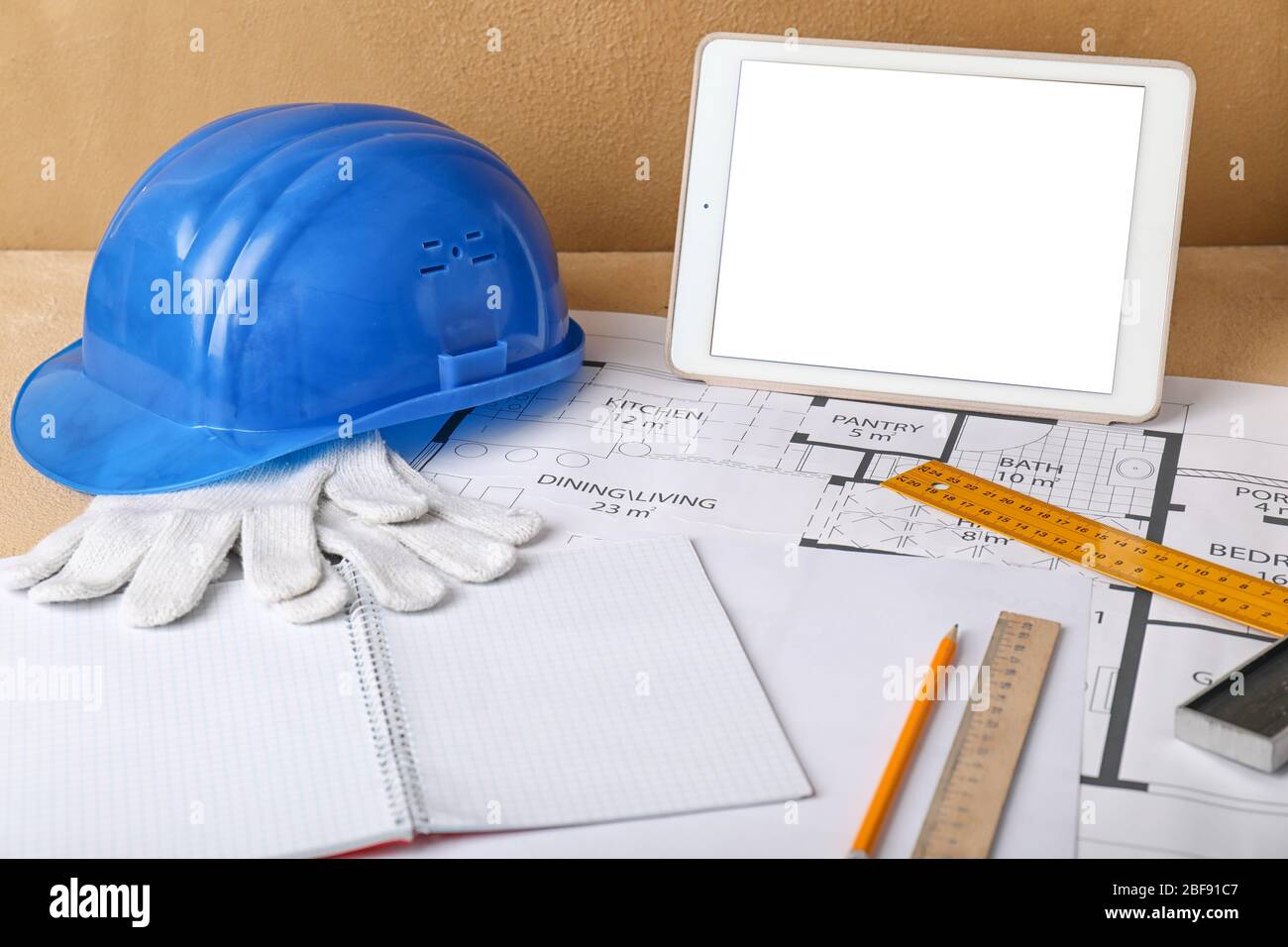 Builder's workplace with tablet computer and house plan Stock Photo - Alamy