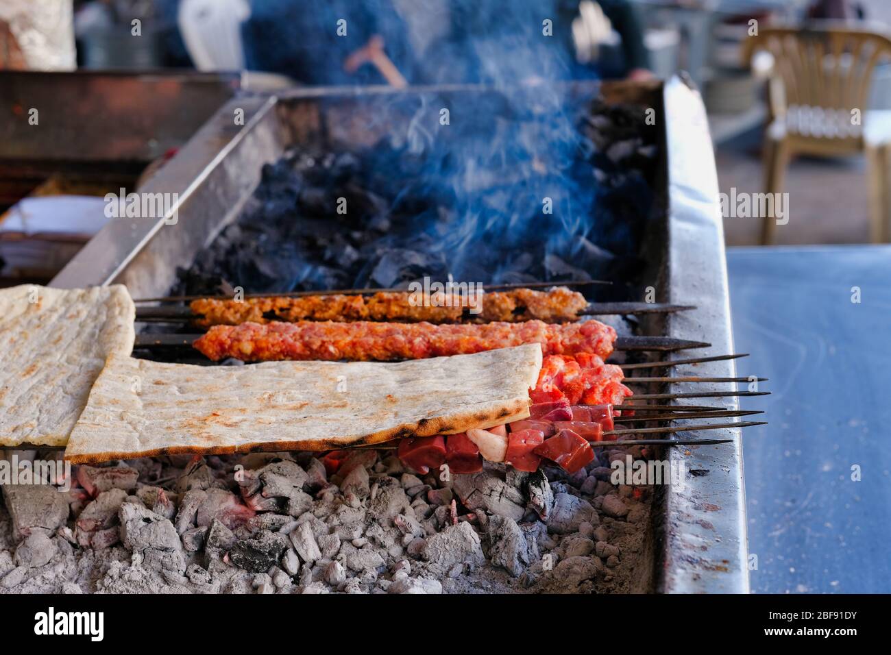 Kebab or kebap on metal skewer barbecue in the kebap restaurant ...