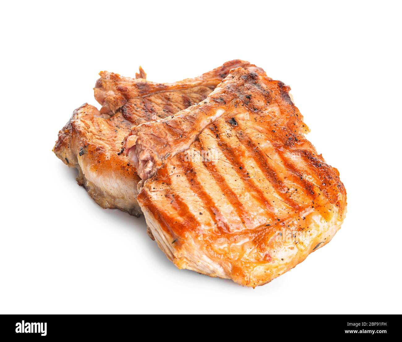 Cooked pork steaks on white background Stock Photo - Alamy