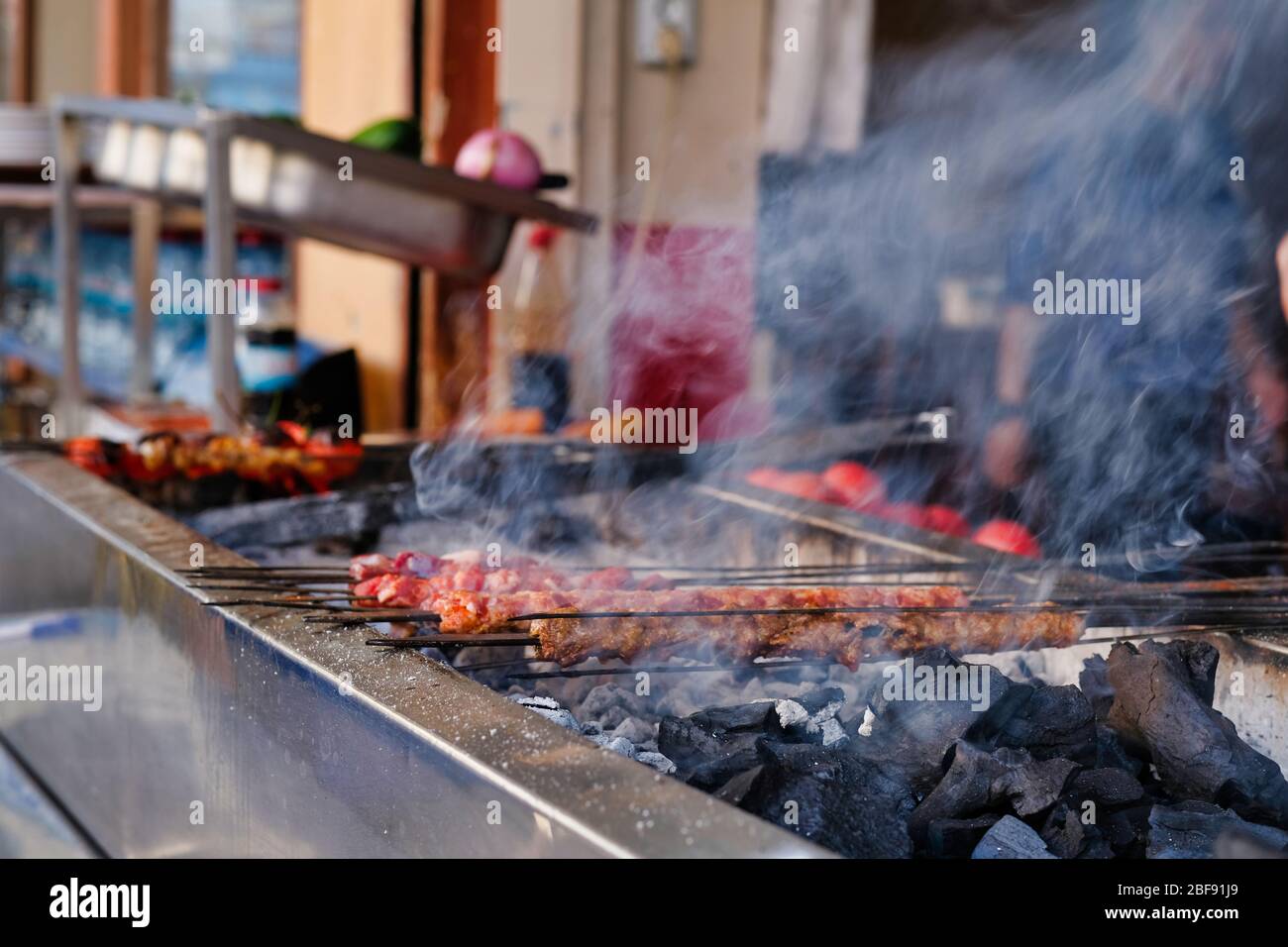 Kebab or kebap on metal skewer barbecue in the kebap restaurant ...