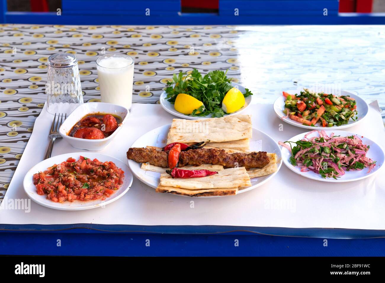 Kebab or kebap on metal skewer barbecue in the kebap restaurant ...