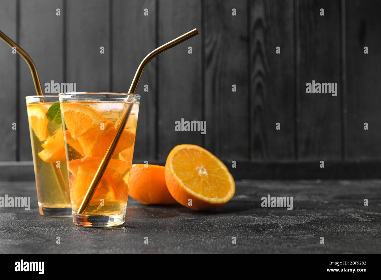 Glasses of tasty cold ice tea on dark background Stock Photo - Alamy