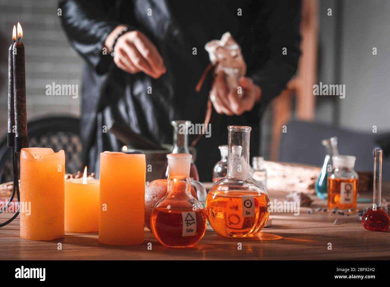 Male alchemist making elixir in laboratory Stock Photo - Alamy