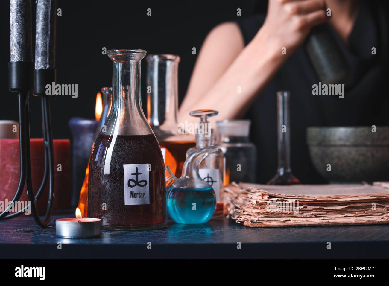 Glassware with potions on table of alchemist Stock Photo - Alamy