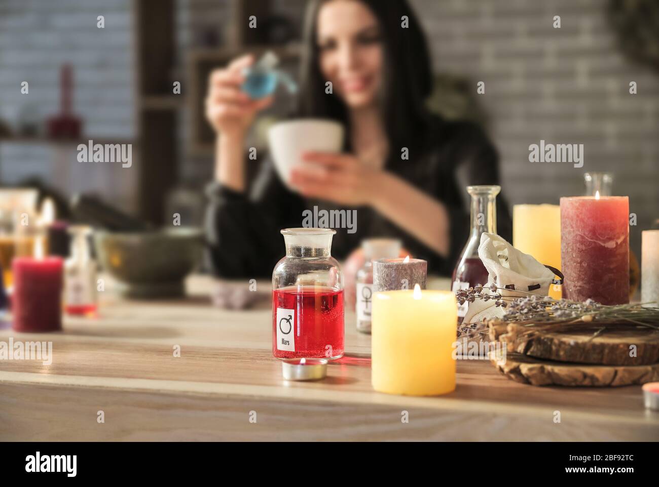 Female alchemist making elixir in laboratory Stock Photo - Alamy