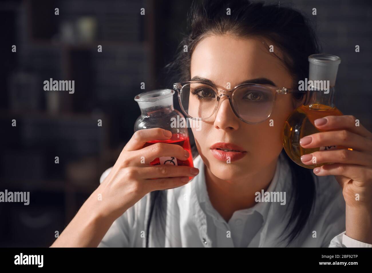 Female alchemist with potions in laboratory Stock Photo - Alamy