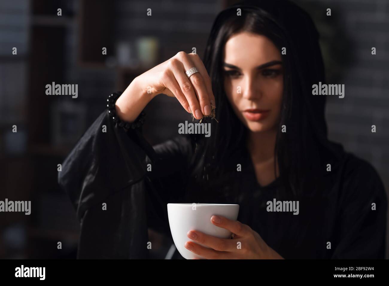 Female alchemist making elixir in laboratory Stock Photo - Alamy