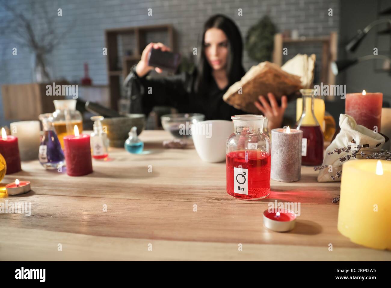 Female alchemist making elixir in laboratory Stock Photo - Alamy