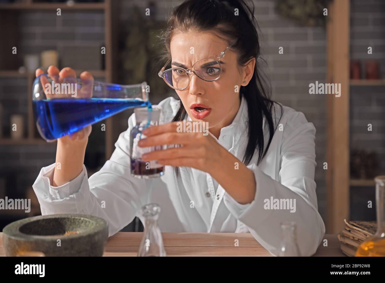 Crazy alchemist working in laboratory Stock Photo - Alamy