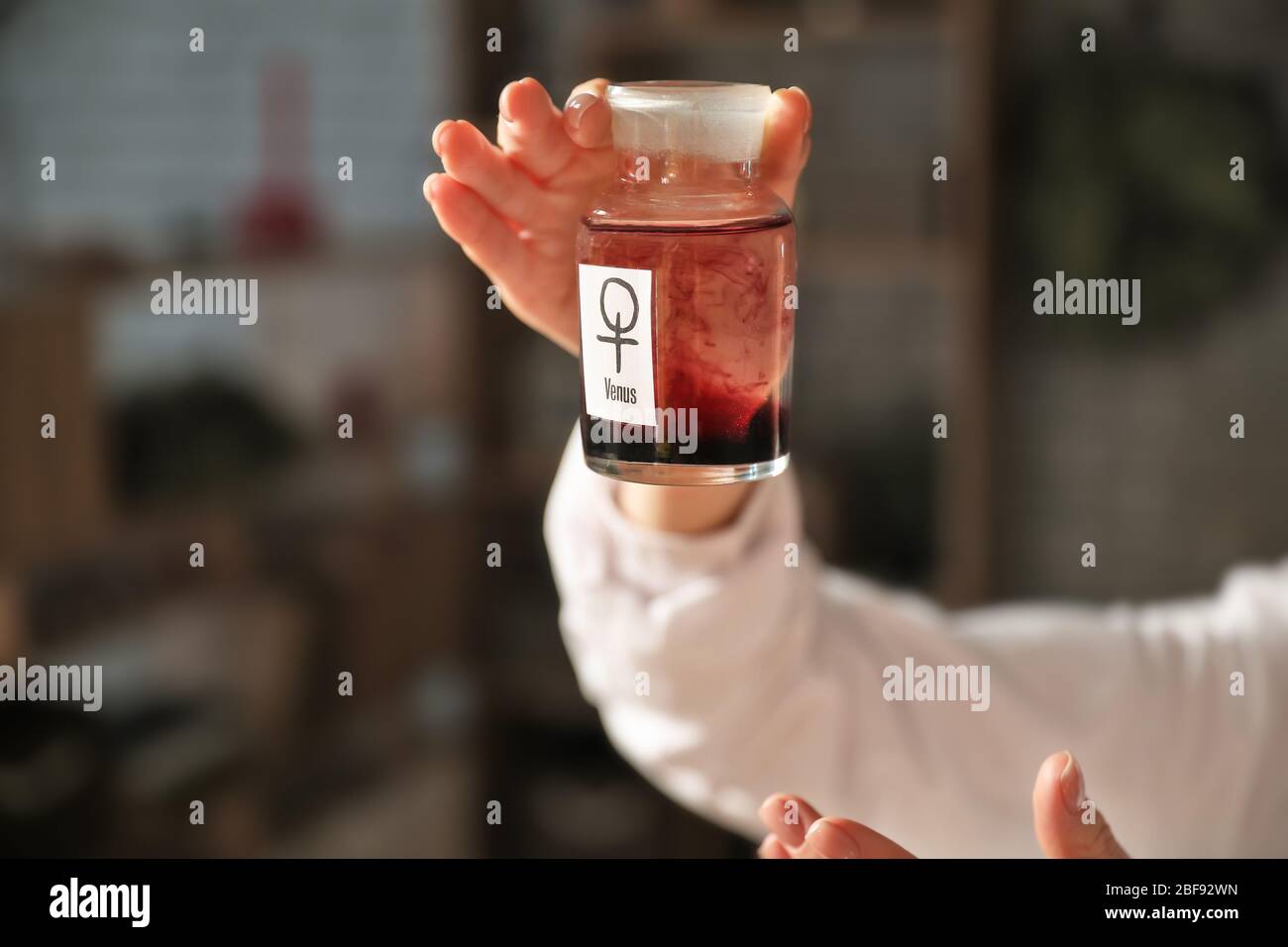 Female alchemist with potion in laboratory Stock Photo - Alamy