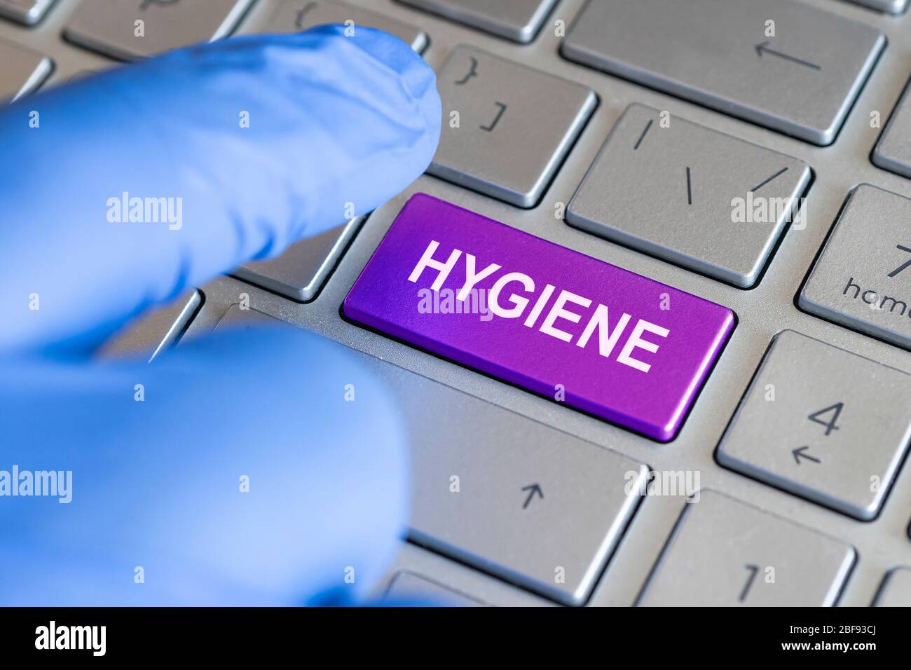 hygiene word on keyboard button, protection from germs. A finger in a ...