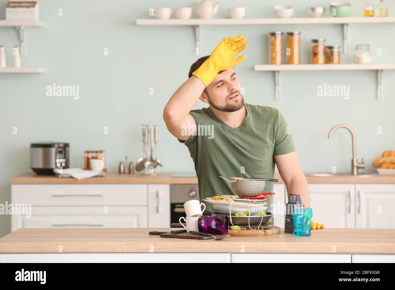 Man washing dirt dishes in hi-res stock photography and images - Alamy