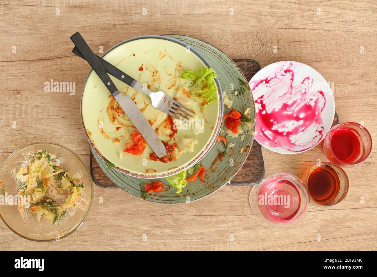 Pile of dirty dishes on kitchen table Stock Photo - Alamy