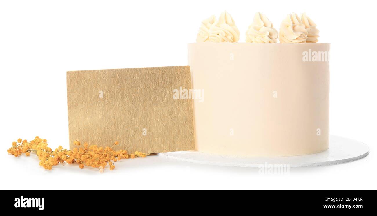 Tasty cake with empty greeting card on white background Stock Photo - Alamy