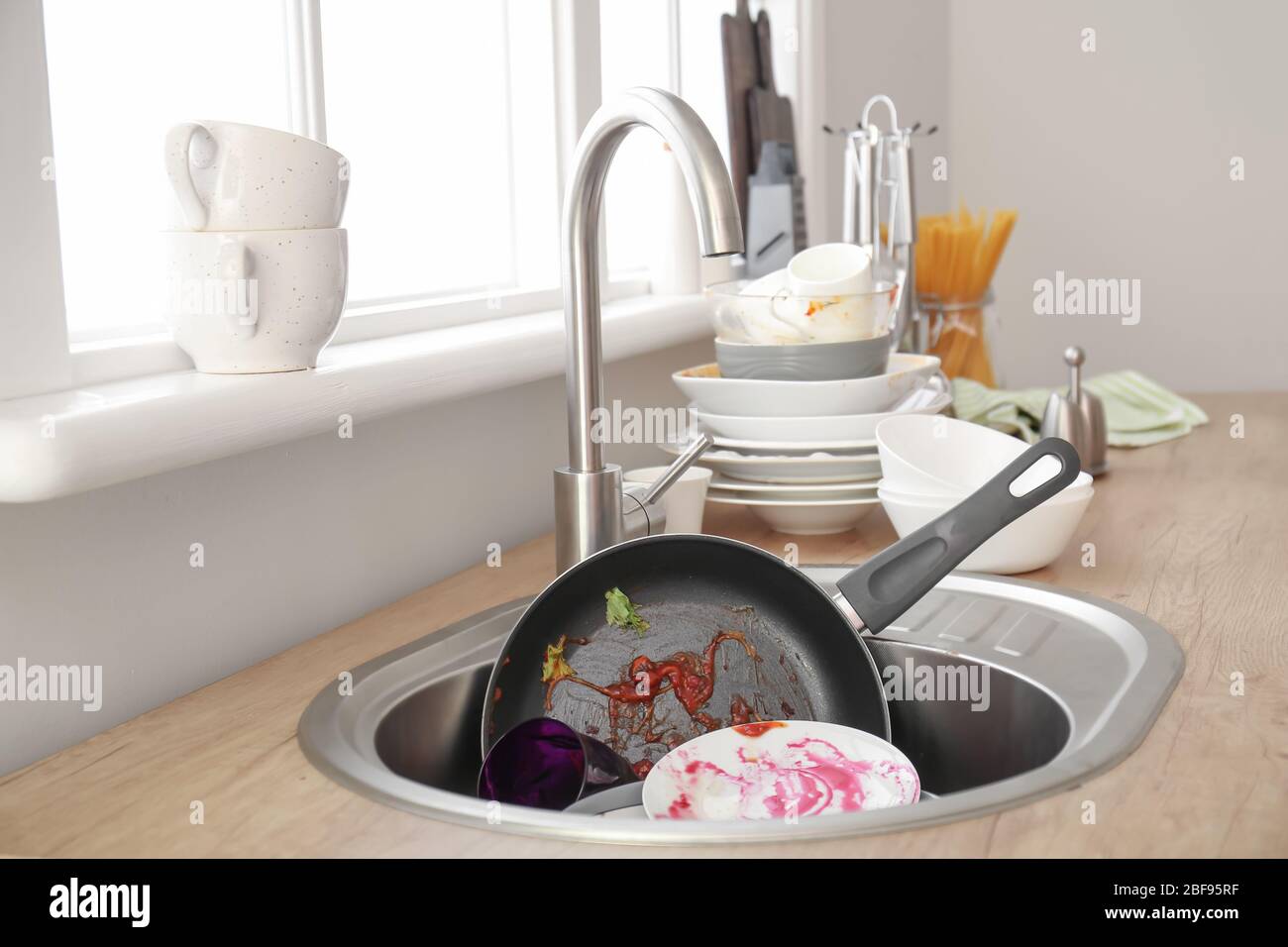 Many dirty dishes in kitchen Stock Photo - Alamy