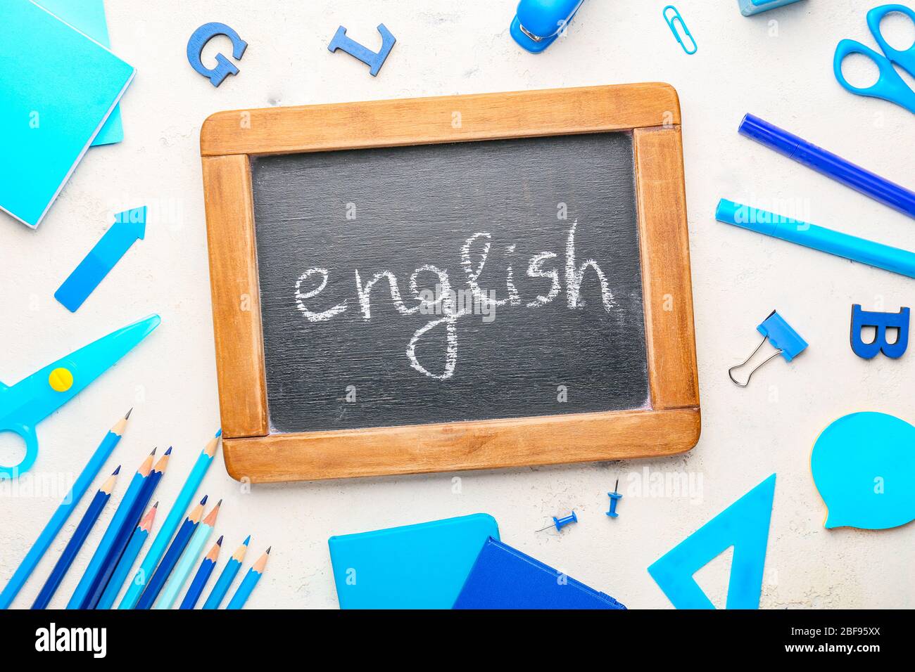 Chalkboard with text ENGLISH and stationery on white background Stock ...