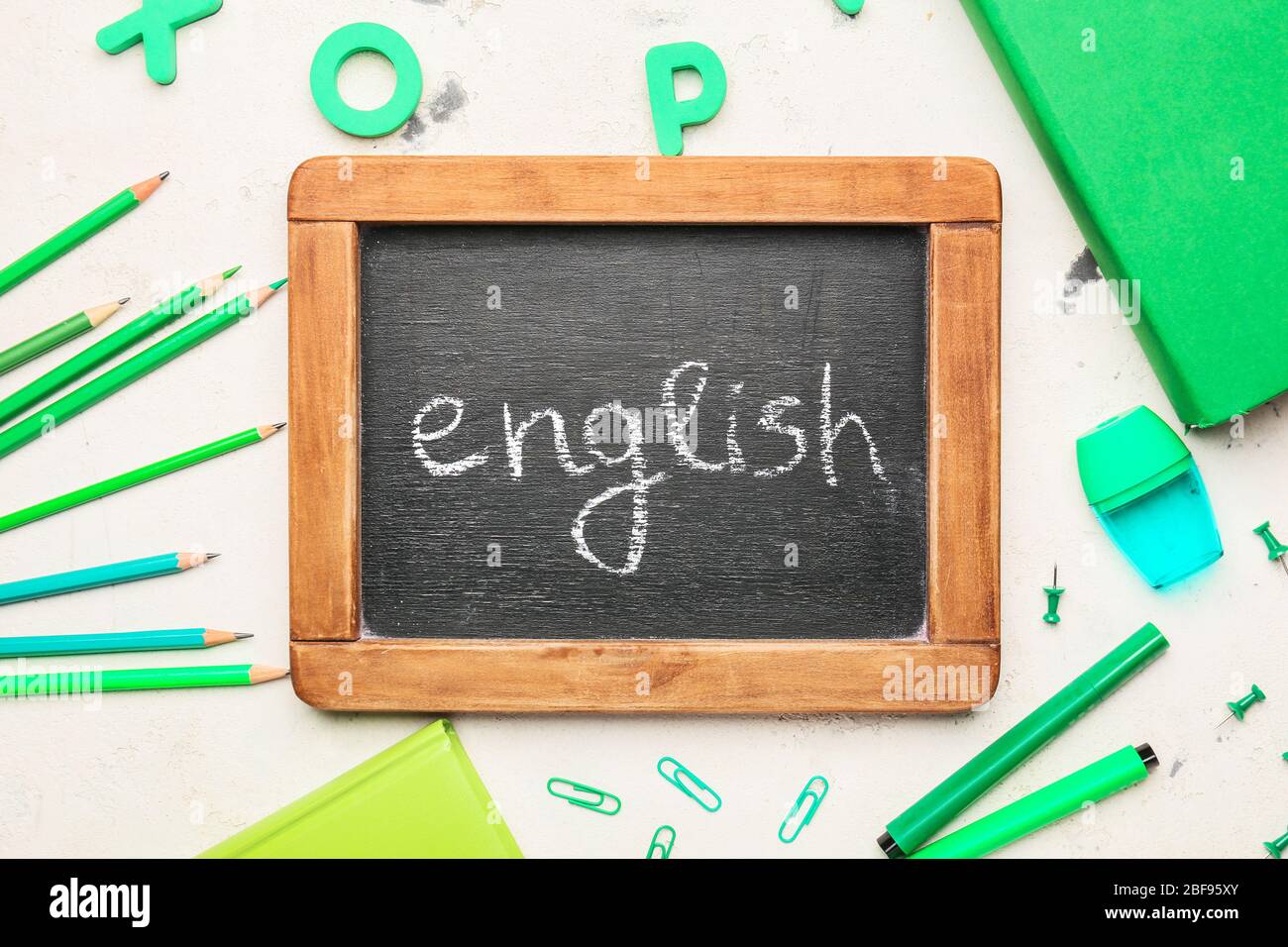 Chalkboard with text ENGLISH and stationery on white background Stock ...