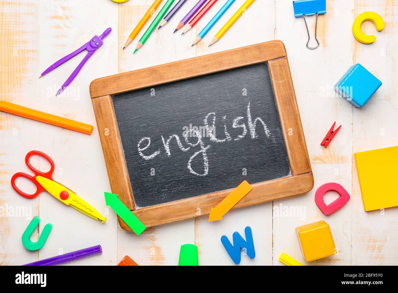 Chalkboard with text ENGLISH and stationery on white background Stock ...