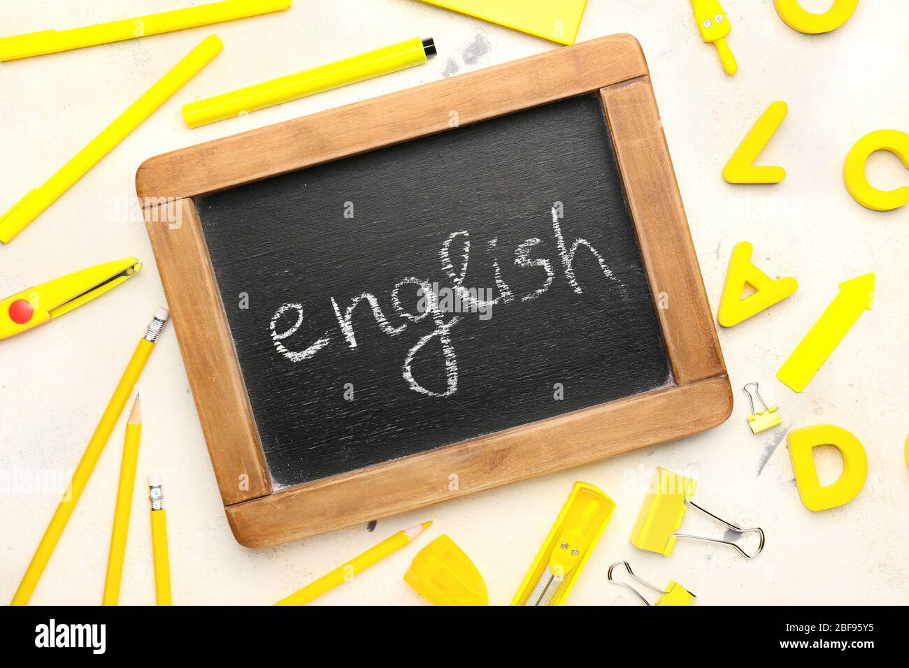 Chalkboard with text ENGLISH and stationery on white background Stock ...