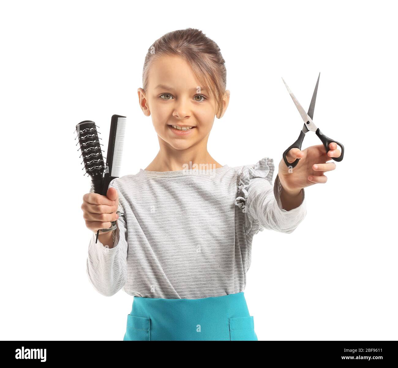 Cute little hairdresser on white background Stock Photo - Alamy