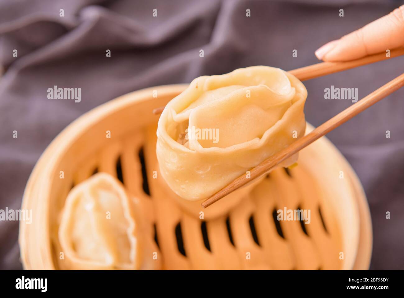 Asian person eating dumpling hi-res stock photography and images - Alamy