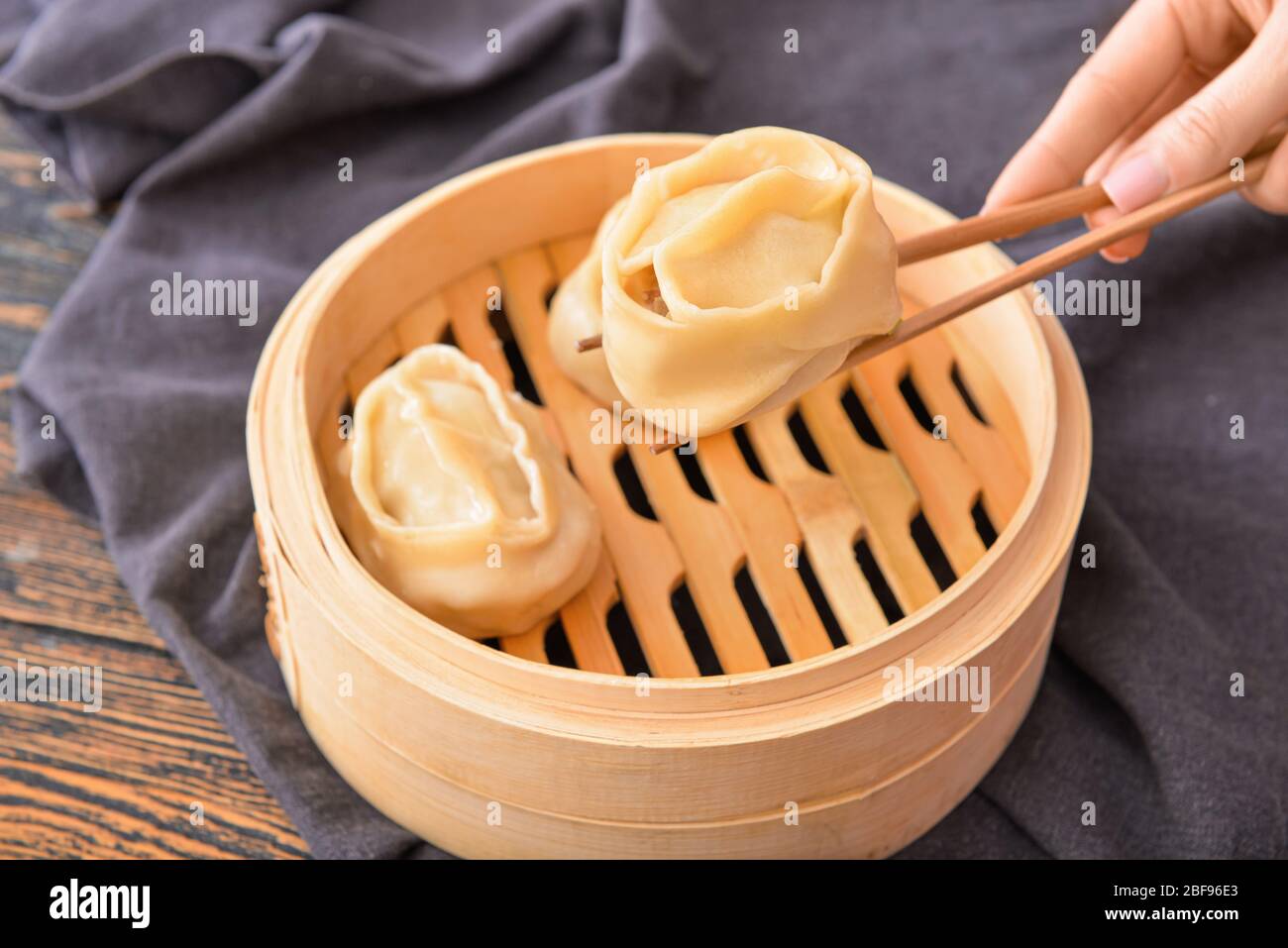 Asian person eating dumpling hi-res stock photography and images - Alamy