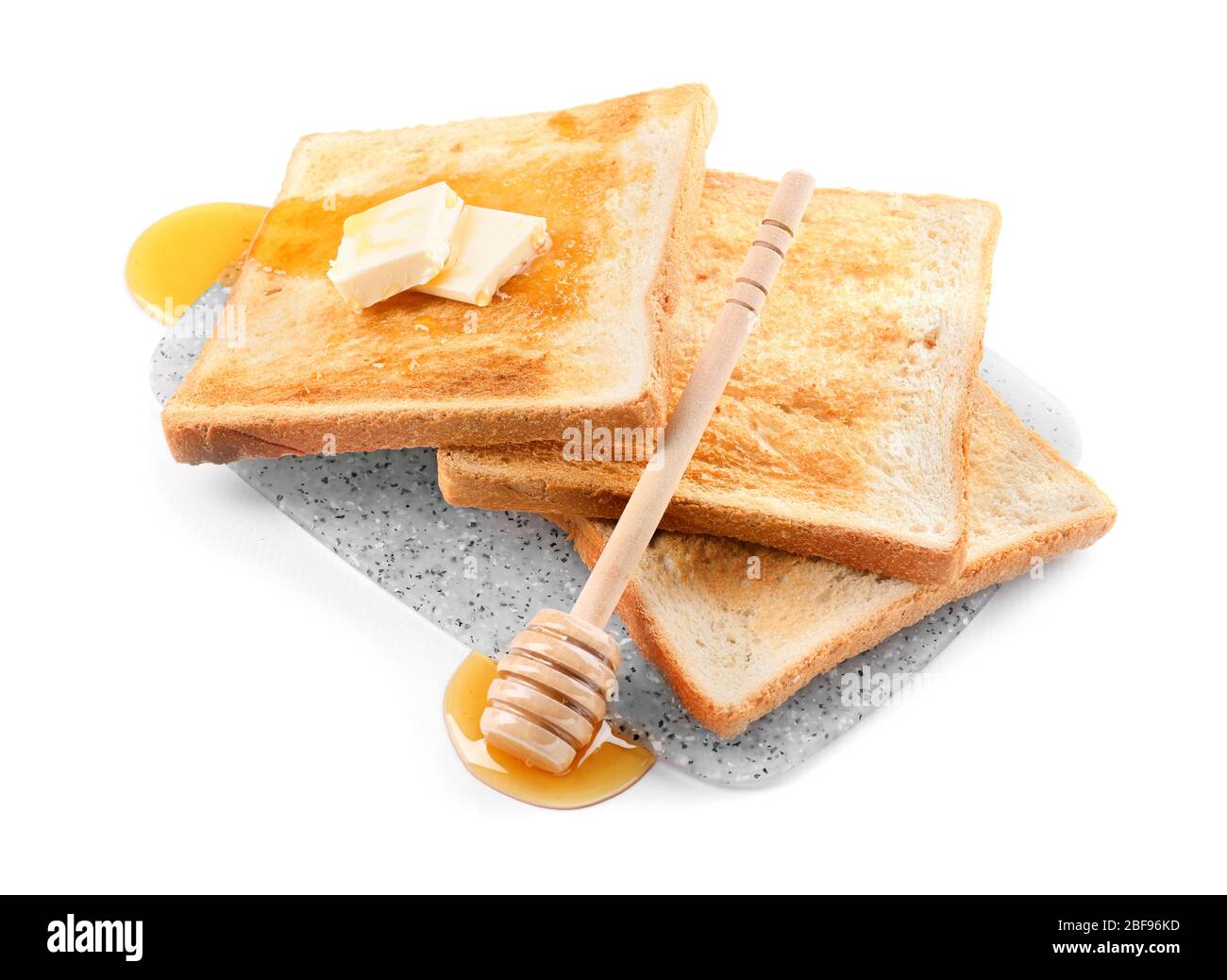 Tasty toasted bread with honey and butter on white background Stock ...
