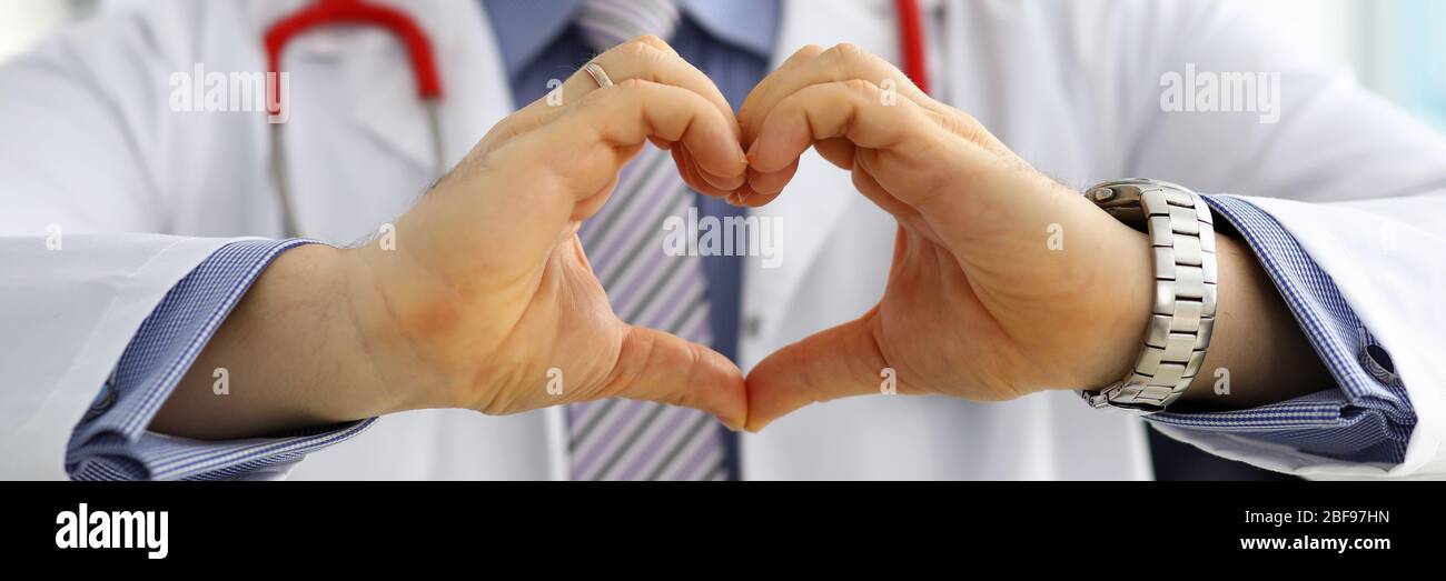 Male medicine doctor hands showing heart shape Stock Photo - Alamy