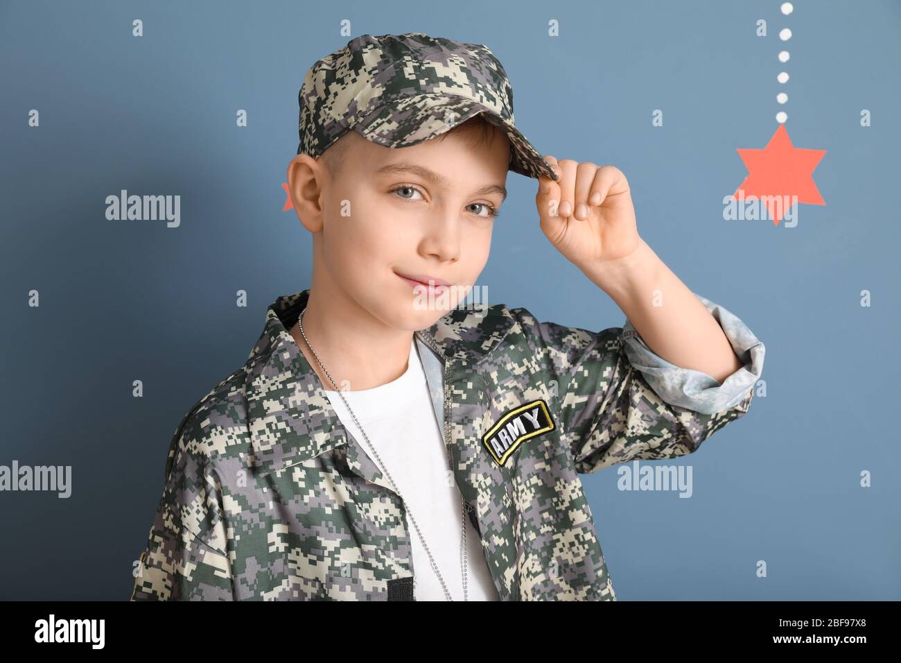 Cute little soldier on color background Stock Photo - Alamy