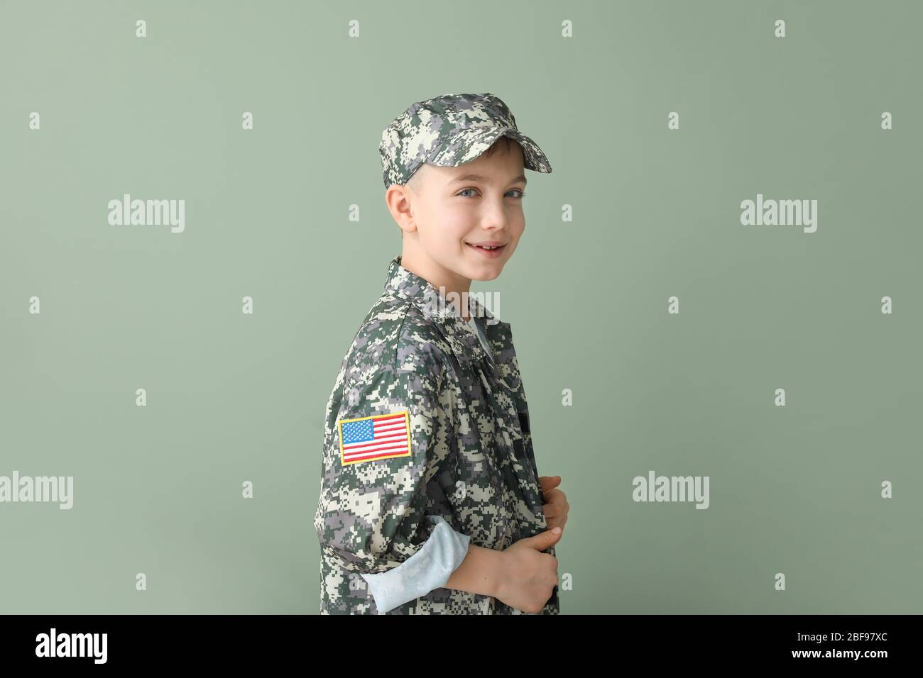 Cute little soldier on color background Stock Photo - Alamy