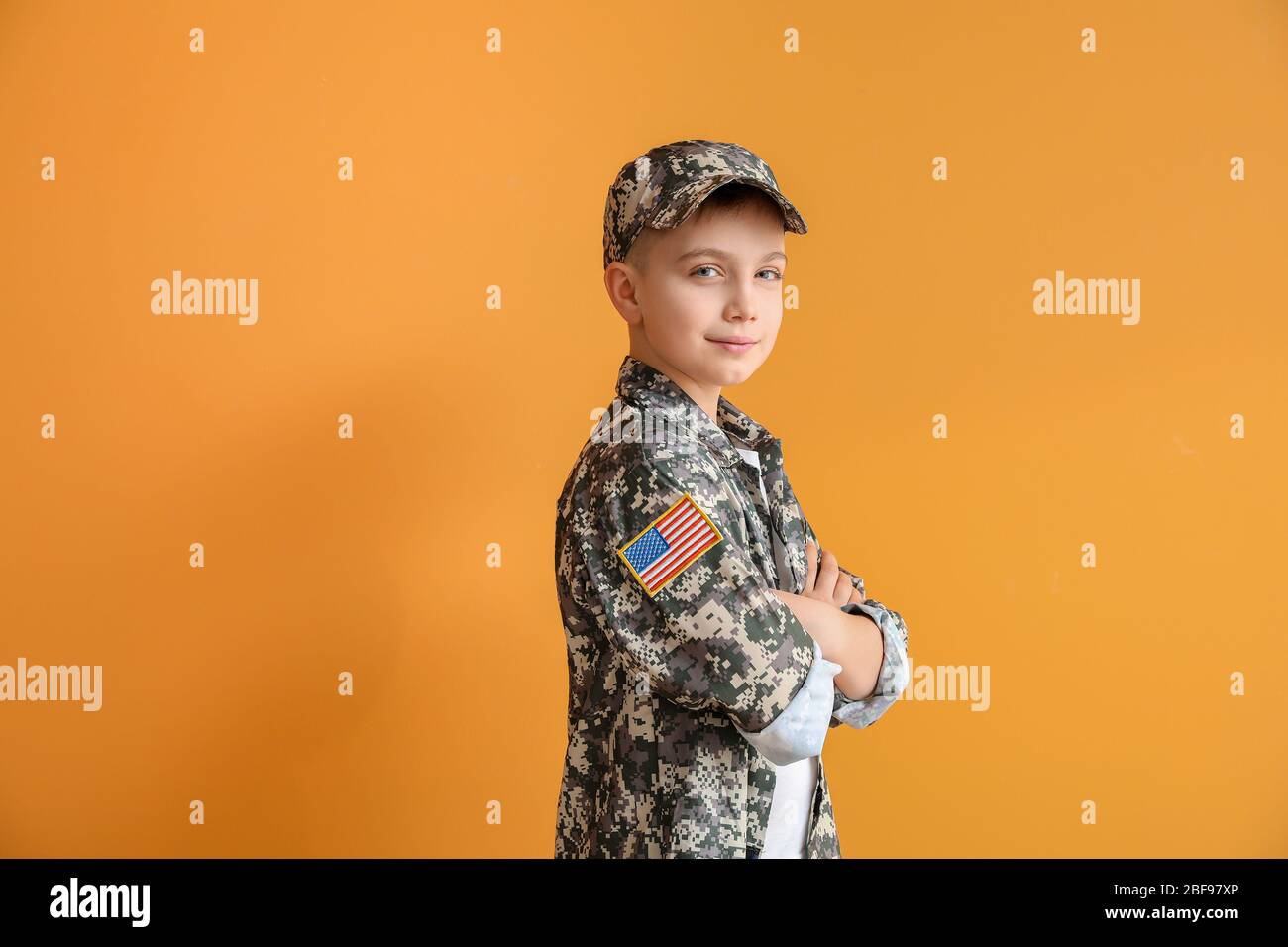 Cute little soldier on color background Stock Photo - Alamy