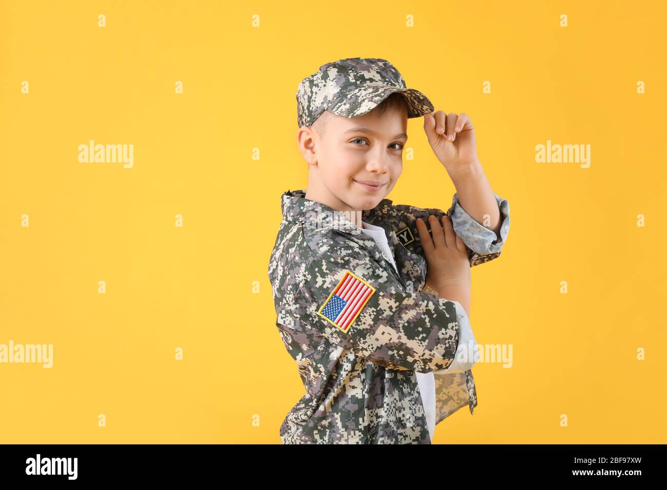 Cute little soldier on color background Stock Photo - Alamy