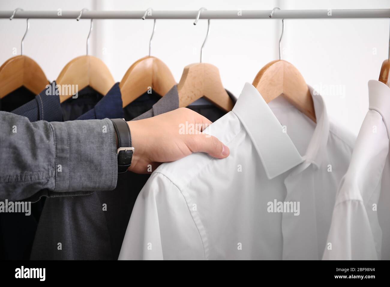 Hand choosing man from many hi-res stock photography and images - Alamy