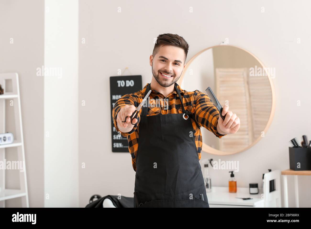 Portrait of male hairdresser in salon Stock Photo - Alamy