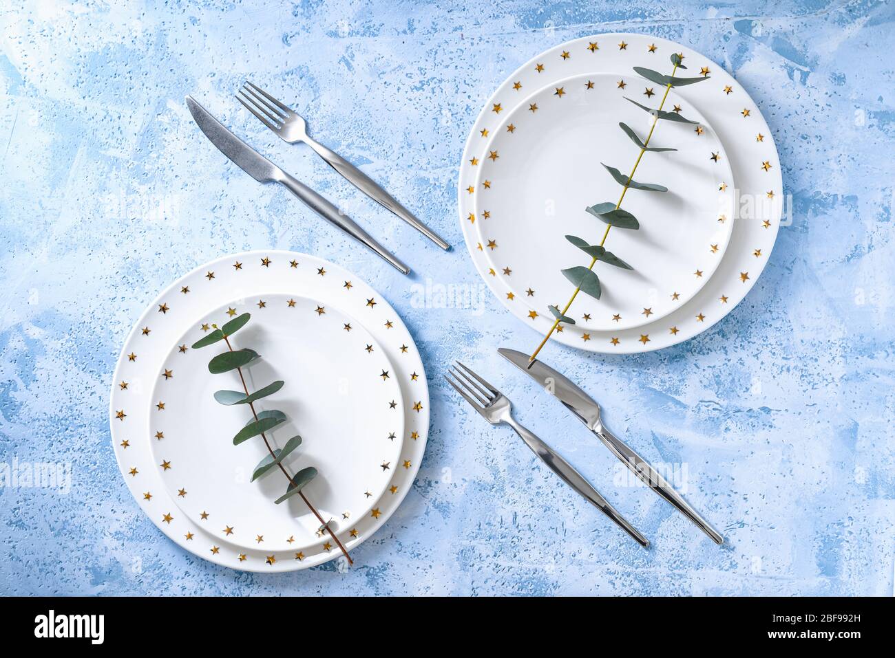 Beautiful simple table setting on color background Stock Photo - Alamy
