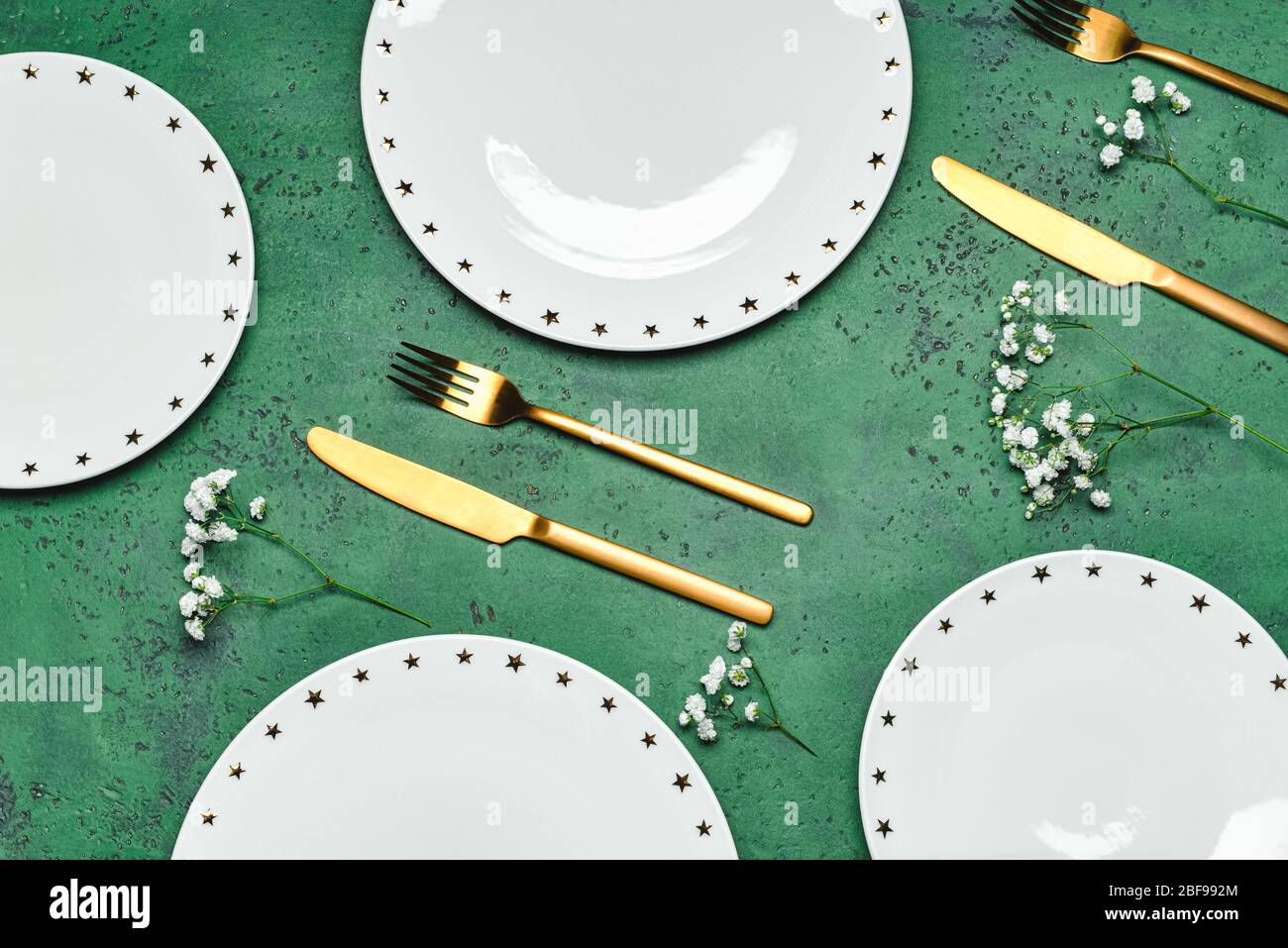 Beautiful simple table setting on color background Stock Photo - Alamy