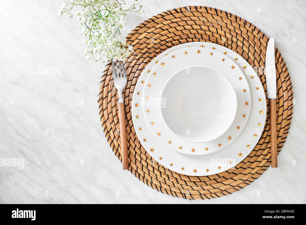 Beautiful simple table setting on white background Stock Photo - Alamy