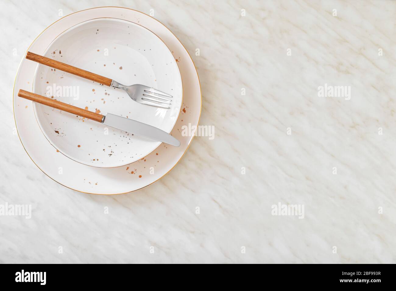 Beautiful simple table setting on white background Stock Photo - Alamy