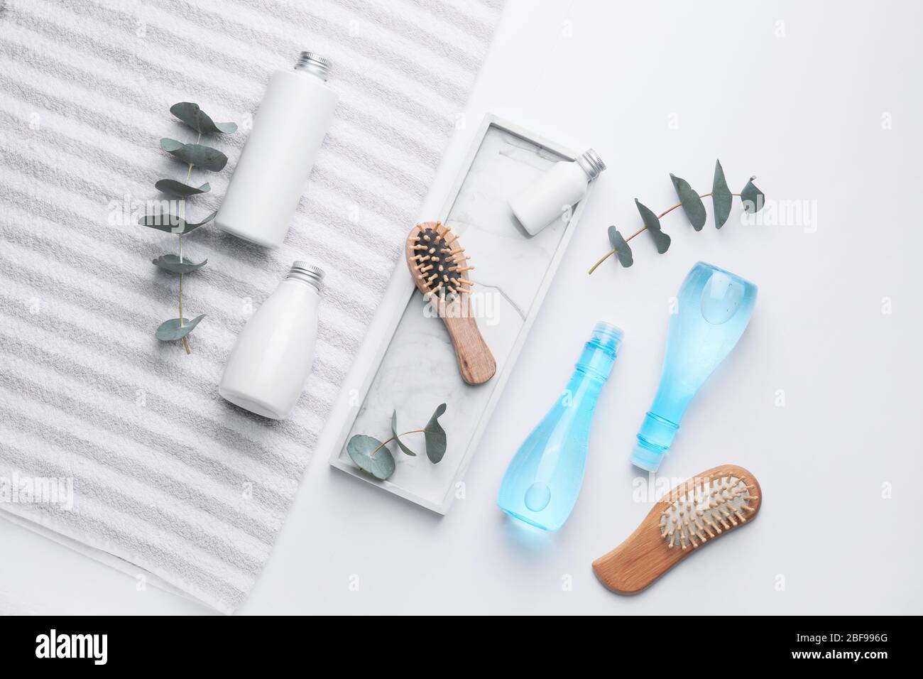 Composition with shampoo and cosmetics for hair on white background ...