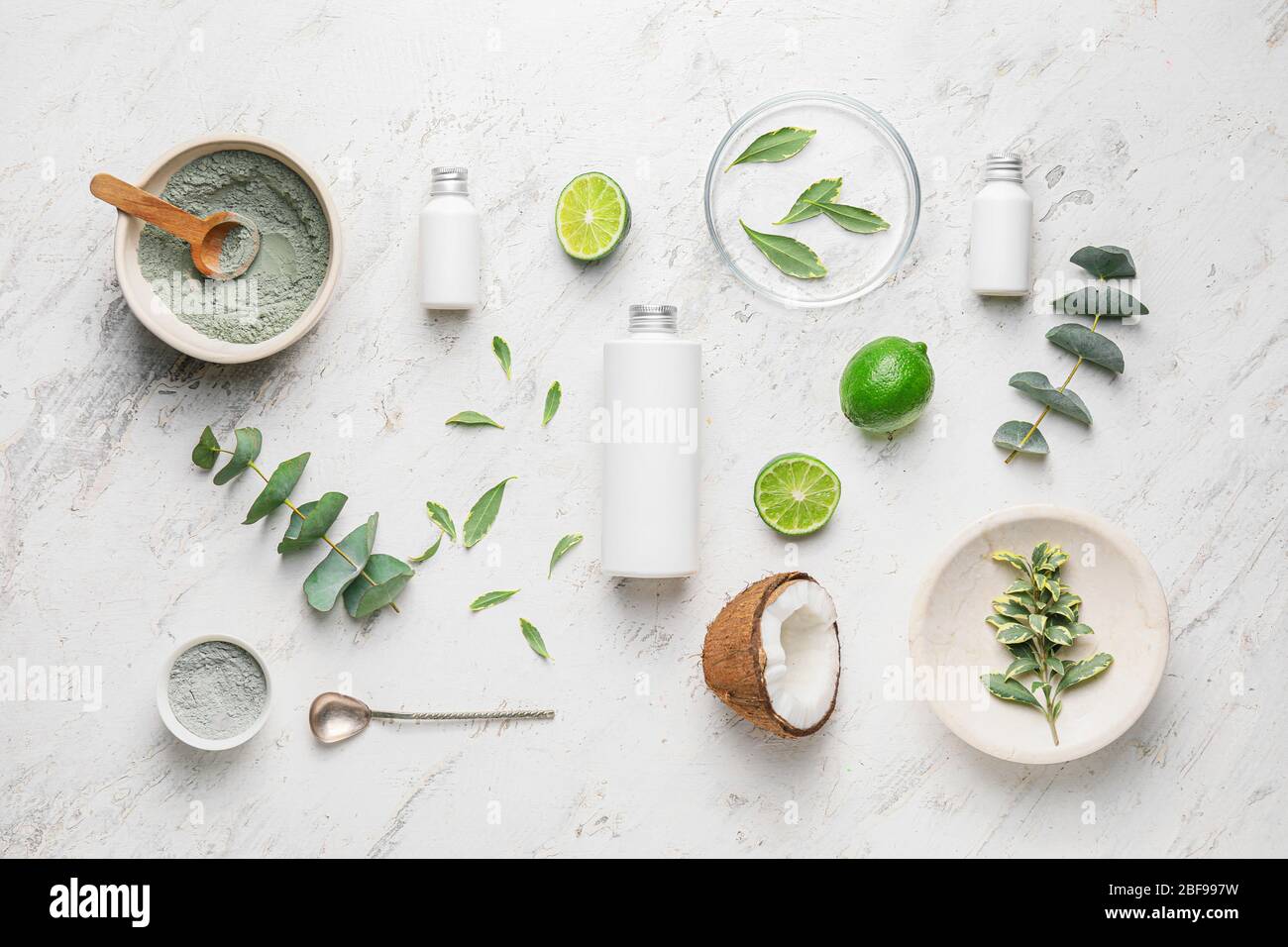 Composition with shampoo and natural ingredients on light background ...
