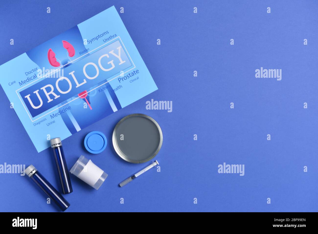 Paper sheet with text UROLOGY, syringe and urine sample on color ...