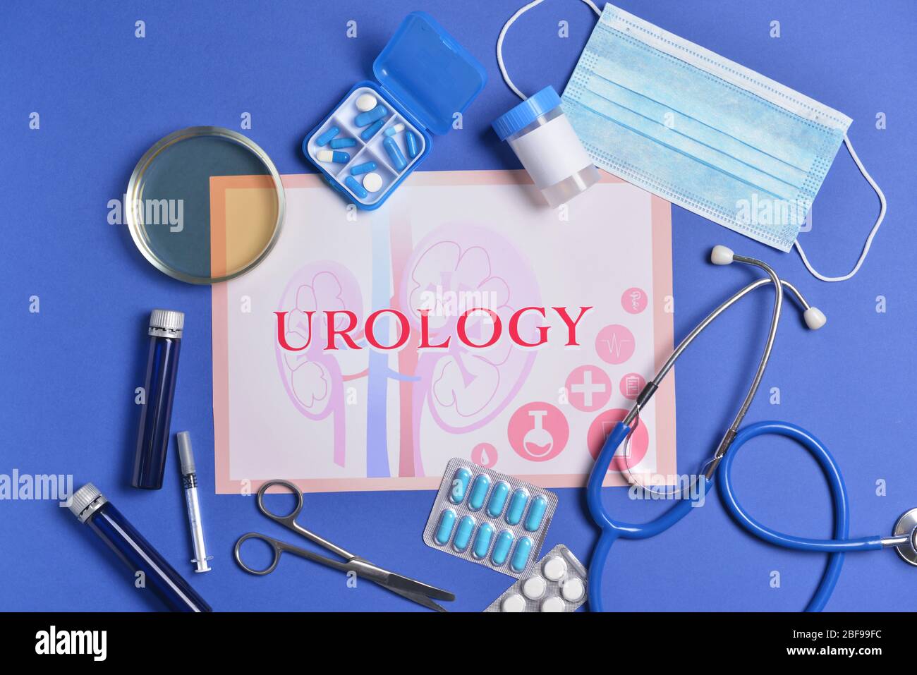 Paper sheet with text UROLOGY, stethoscope, urine sample and medicines ...