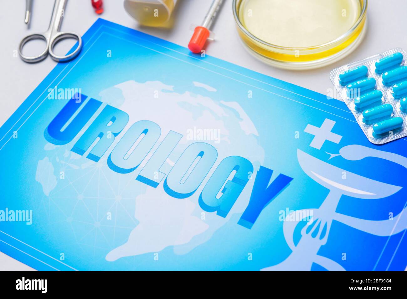 Paper sheet with text UROLOGY, urine sample and medicines on white ...