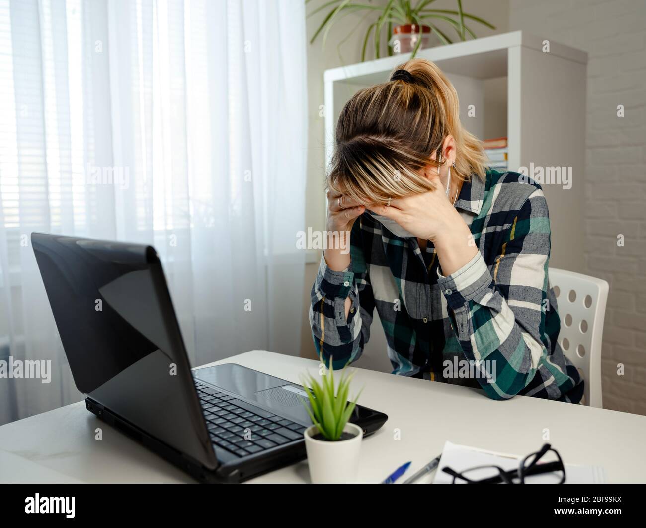 Woman is worried about work, she is irritable and sad Stock Photo - Alamy