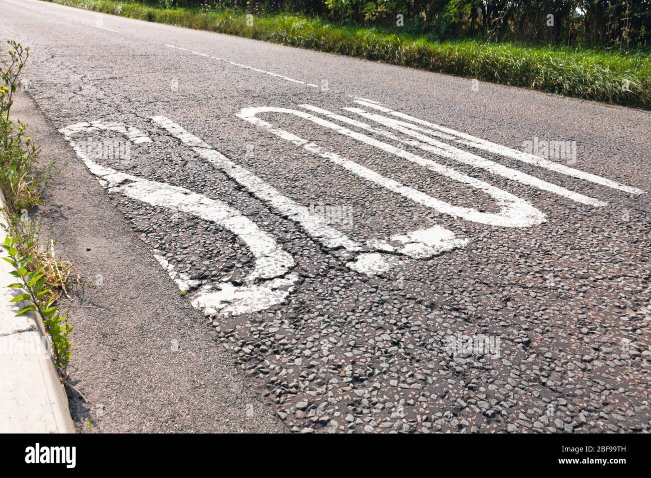 SLOW painted in British main road to assist in road safety, Cheddington ...